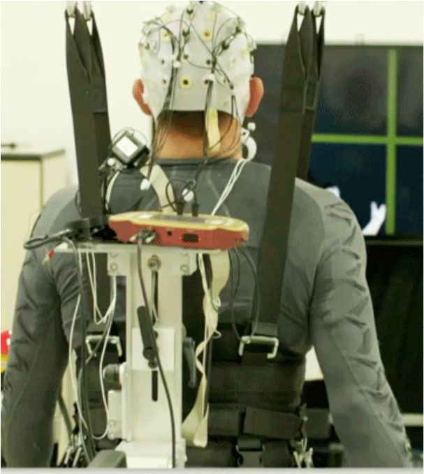 Exoskeleton with haptic sensors helps paralysed man to kick off World ...